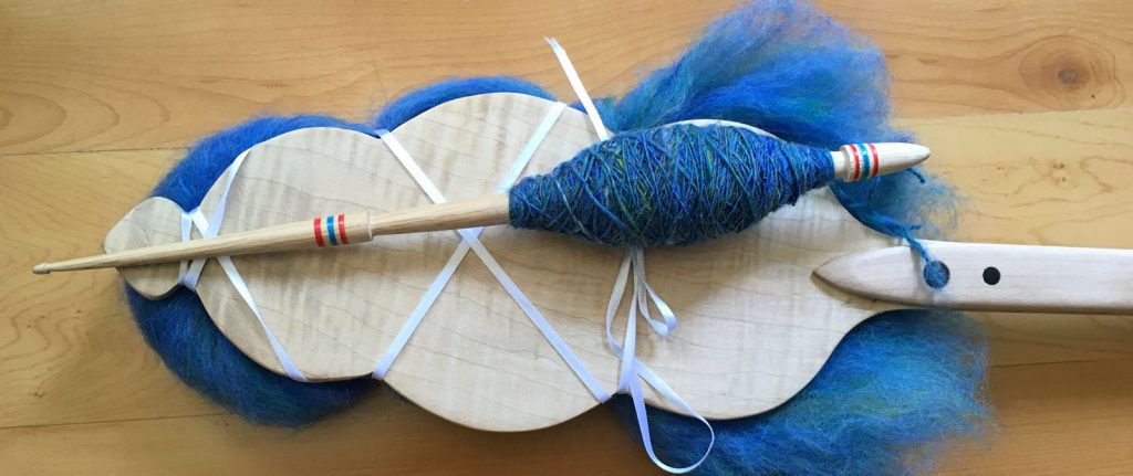 Spinning with a belt distaff – Jumaka